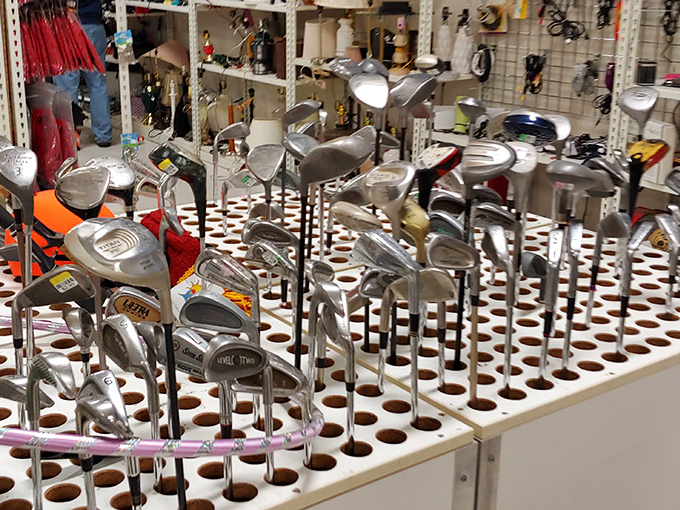 Golf clubs standing at attention like soldiers, ready to help your slice find new and creative water hazards.