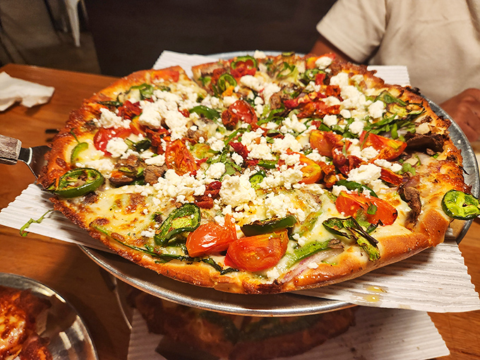 Fresh vegetables dancing atop a golden crust with feta cheese playing the starring role&mdash;proof that vegetarian pizzas can steal the show.