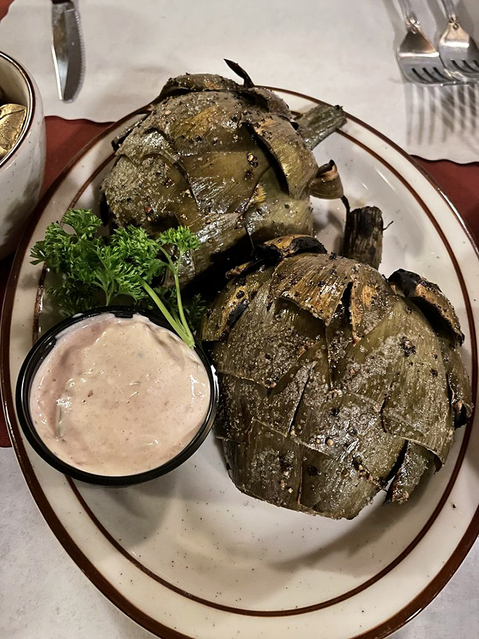 These grilled artichokes might make you forget you came for steak&mdash;charred edges, tender hearts, and a dipping sauce worth bottling.