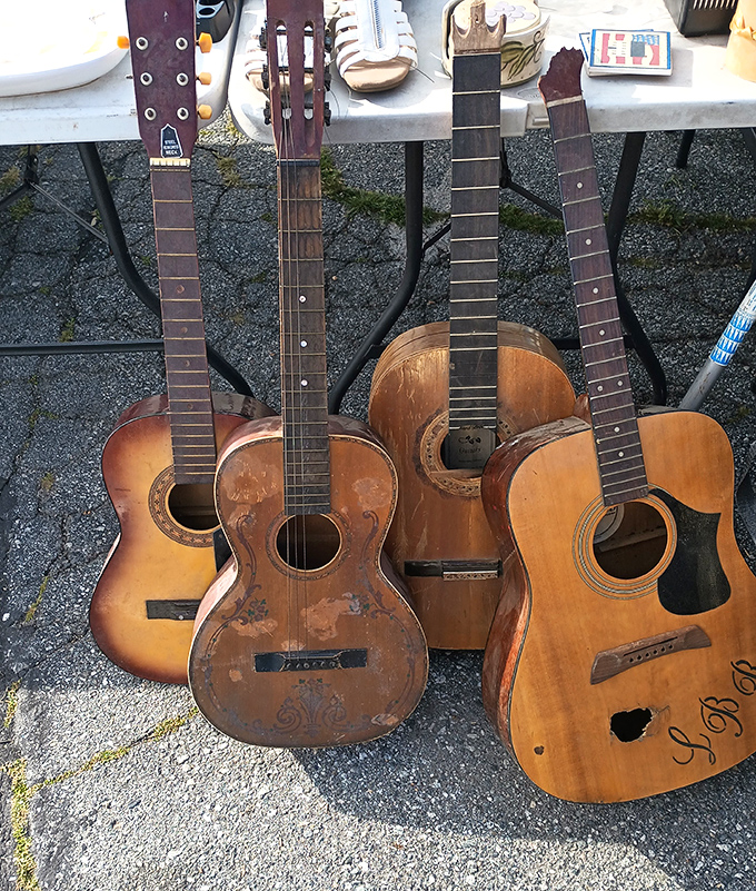 These well-loved guitars have strummed countless campfire songs. Each scratch and dent represents a melody that once filled someone's living room.