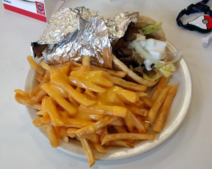 Golden fries swimming in melted cheese&mdash;the kind of guilty pleasure that makes you forget about calories and remember what joy tastes like.