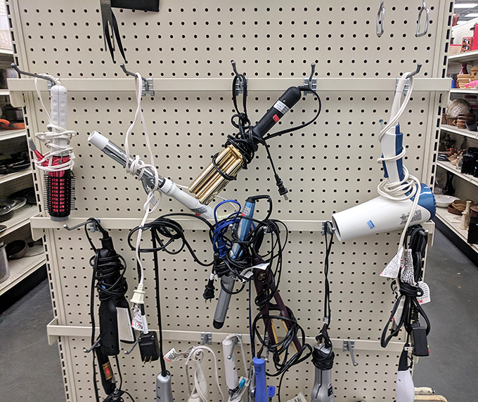 Beauty tools awaiting their next styling session. That curling iron might have created prom updos or wedding day looks before finding its way here.