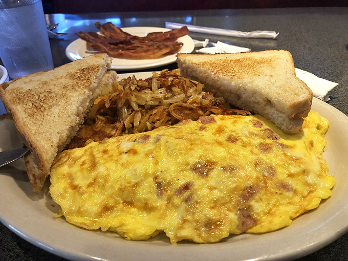 The ham and cheese omelet that launched a thousand road trips. Perfectly executed simplicity with toast standing by for important yolk-sopping duties.