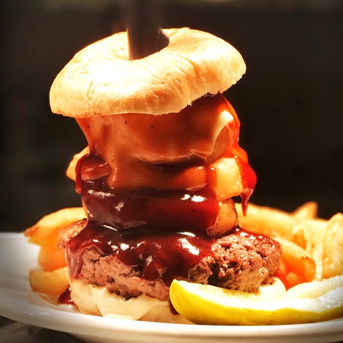 This isn't just a burger &ndash; it's a towering achievement of beef, cheese, and BBQ sauce that makes you wonder if you should unhinge your jaw like a snake.