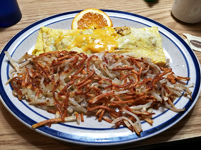 These hash browns deserve their own fan club – crispy exterior giving way to tender potato beneath, the ideal canvas for ketchup artistry.