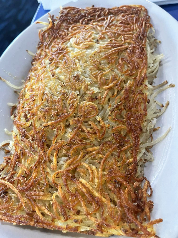 The hash browns here aren't just a side dish – they're an art form. Crispy, golden lattice work that deserves its own gallery exhibition.