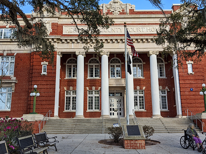 The majestic Hernando County Courthouse stands as Brooksville's crown jewel, its columns and red brick a testament to small-town civic pride.