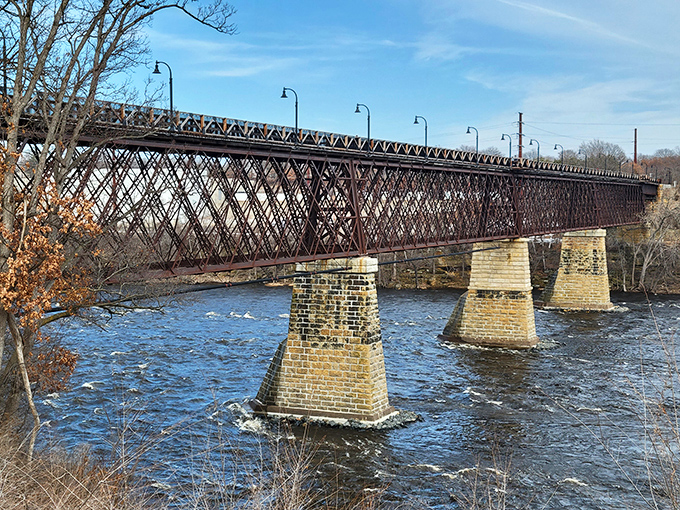 The historic High Bridge spans the Chippewa River like an iron sentinel, its weathered trusses telling stories of lumber booms and railroad glory days.