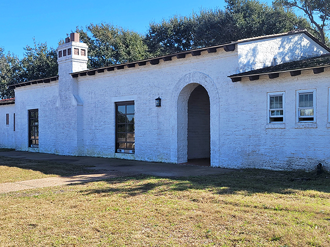 The historic Recreation Hall stands as a whitewashed reminder of the park's past, its Spanish-inspired architecture providing a cool retreat from the Texas sun.