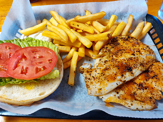 The fish sandwich that launched a thousand road trips &ndash; perfectly seasoned, expertly grilled, and served with fries that demand to be stolen one by one.