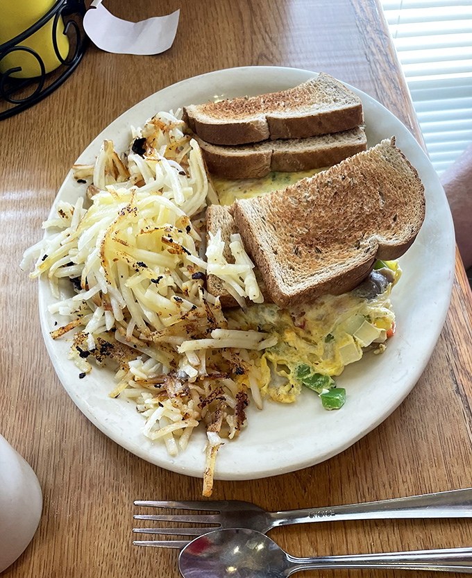 Breakfast done right &ndash; where hash browns meet eggs in that perfect morning marriage that makes you forget you're not a morning person.