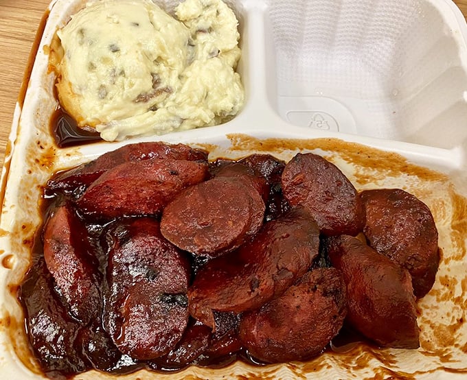 Beef links glistening with sauce &ndash; these aren't your ballpark franks, folks. They're the Cadillacs of sausage, all dressed up with somewhere to go.