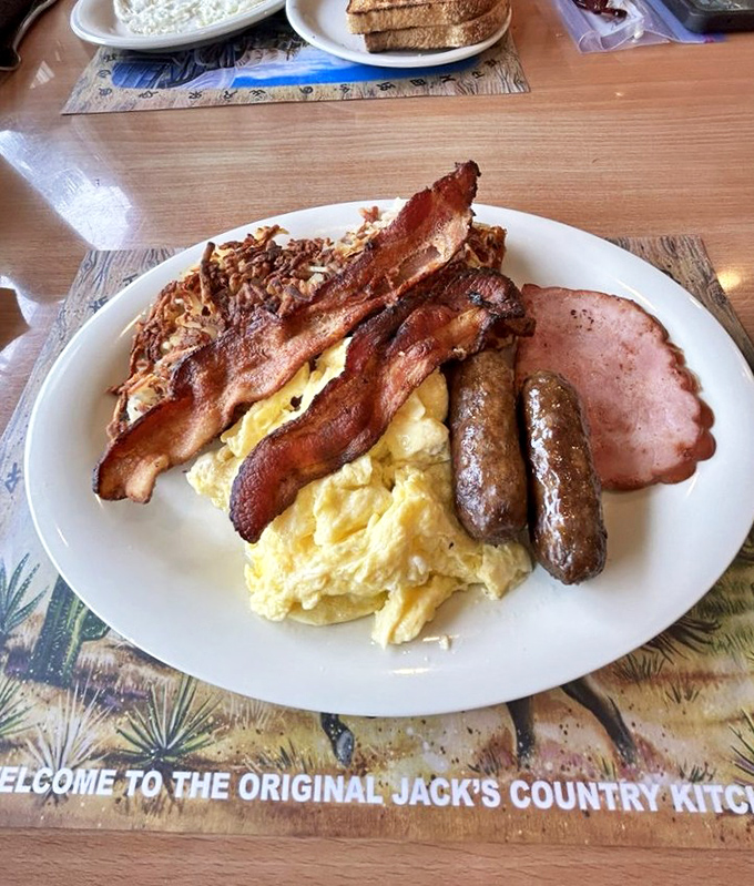 Breakfast perfection: crispy bacon, fluffy eggs, and sausage links that would make any morning worth getting up for, even on vacation.