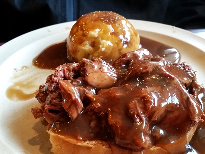 Hot beef sandwich&mdash;the Midwest's answer to French dip&mdash;swimming in gravy with a golden dumpling island that's worth the journey alone.