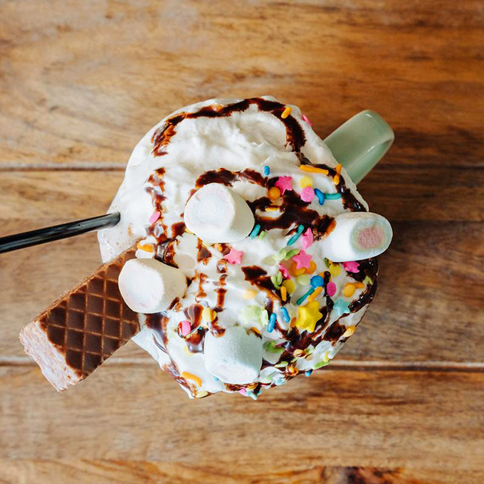 Hot chocolate elevated to an art form&mdash;topped with whipped cream, marshmallows, and sprinkles that would make Willy Wonka nod in approval.