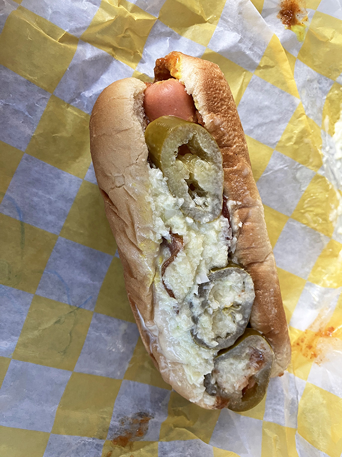 Hot dogs achieve their highest purpose here, where jalapeños add just enough kick to wake up your taste buds without sending them into panic mode.