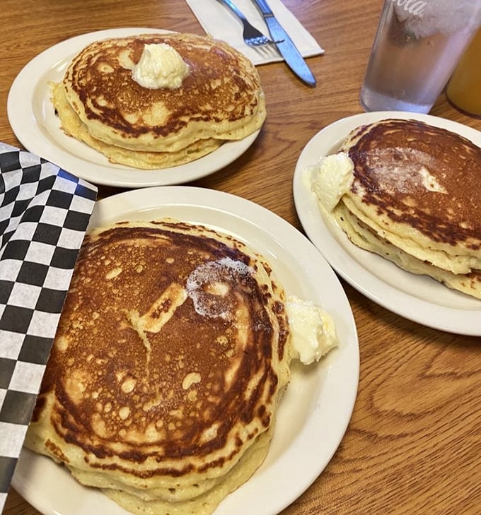 The famous "Heavenly Hot Cakes" in their golden-brown glory. These aren't just pancakes; they're fluffy discs of joy that make mornings worth facing.