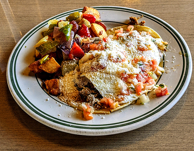 Huevos Rancheros: where breakfast meets fiesta. Those roasted potatoes on the side aren't just supporting actors&mdash;they're scene-stealers.
