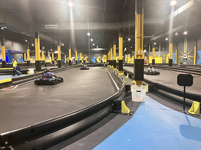 The go-kart track stretches before you like a miniature Monaco Grand Prix, where everyday drivers transform into racing legends for three glorious minutes.