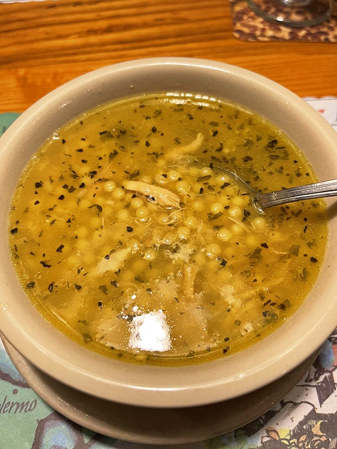 Italian wedding soup that warms the soul faster than your grandmother's hug. Those tiny meatballs are swimming in liquid gold.