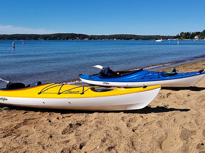 Beach day, Wisconsin style! These kayaks wait patiently for their next adventure, like colorful chariots ready to explore Lake Geneva's secrets.