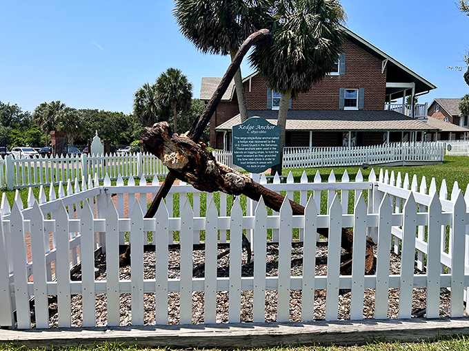 This massive kedge anchor once kept ships from drifting into trouble, much like your morning coffee keeps you from drifting back to bed.