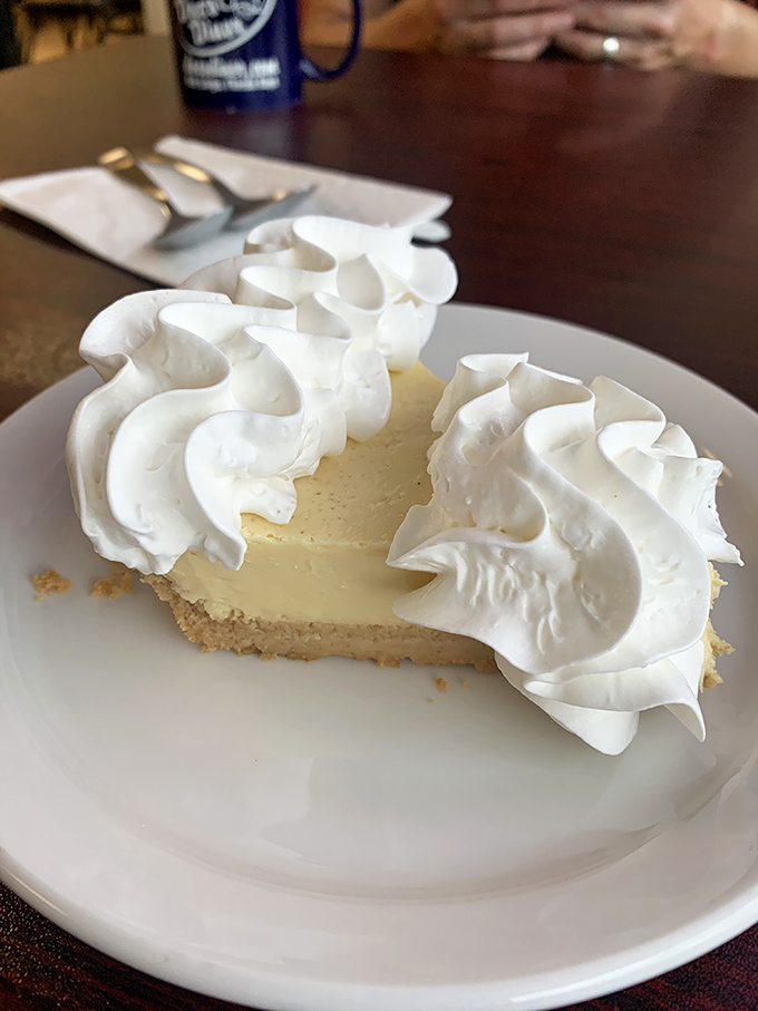 Key lime pie that strikes that magical balance between tart and sweet, topped with clouds of whipped cream that deserve their own weather report.