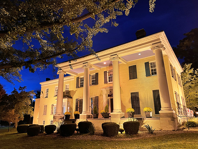 Elegant columns and warm lighting transform this historic Warren mansion after dark, proving affordable cities can still deliver moments of grandeur.