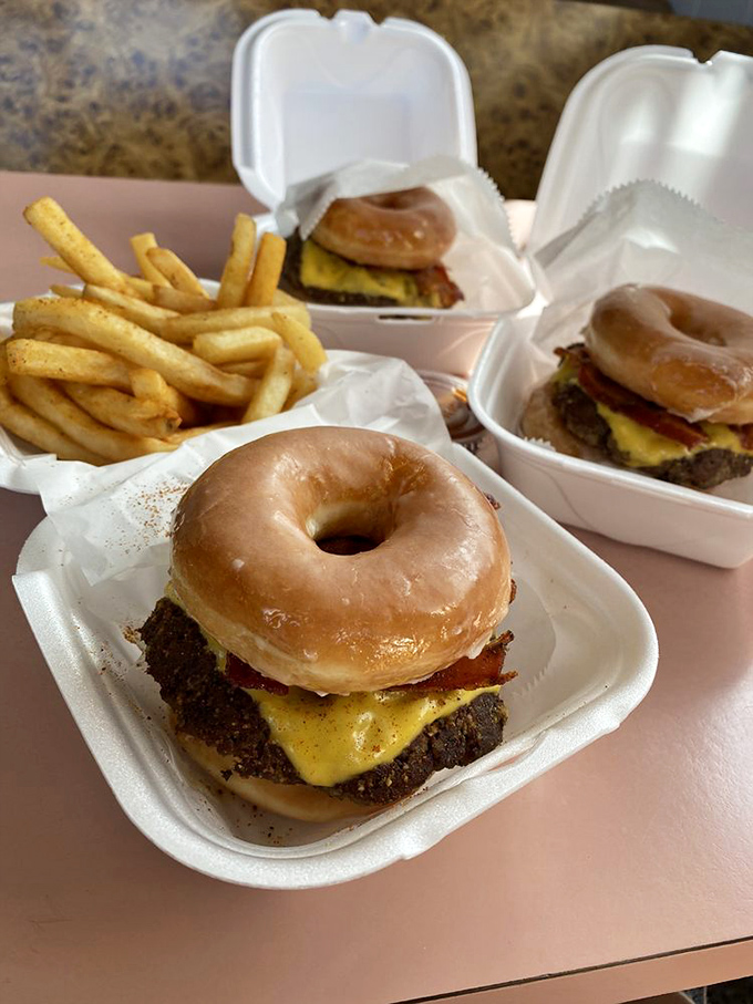 The Krispy Kreme burger—where sweet meets savory in an unholy alliance that somehow works. Your cardiologist won't approve, but your taste buds will.