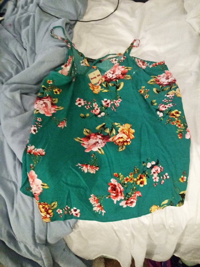 This vibrant floral top is summer in fabric form. Someone's fashion loss becomes your closet's gain!