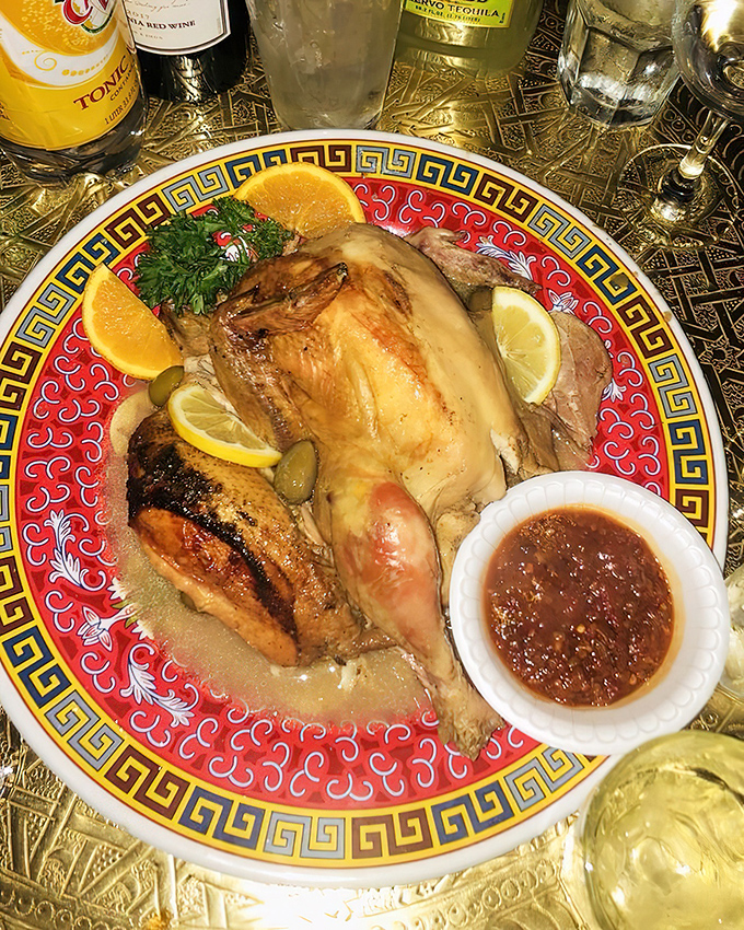 Golden chicken that's traveled through a flavor passport of lemon, olives, and mysterious spices&mdash;served with a side of sauce that demands to be sopped up with bread.
