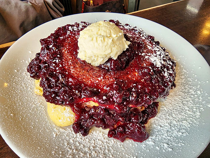 Berry-topped pancakes with a scoop of ice cream – because sometimes breakfast needs to dress up as dessert to start your day right.
