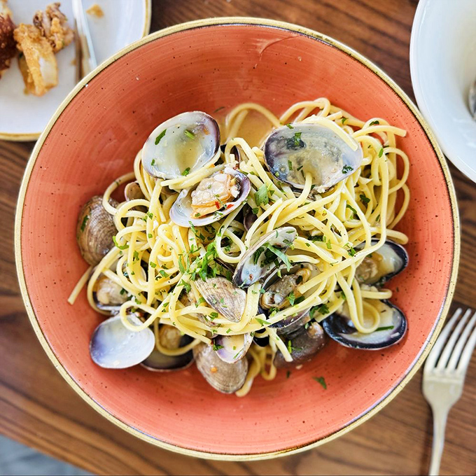 The linguine con vongole &ndash; where pasta meets the sea in a delicious rendezvous. These clams didn't just come to play; they came to transform your lunch into a coastal Italian holiday.