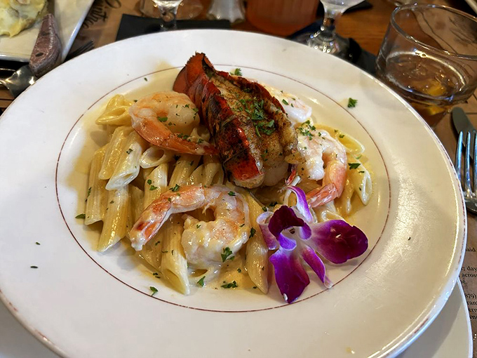 Pasta perfection with plump shrimp and a delicate sauce that would make an Italian grandmother nod in approval. That purple orchid adds dramatic flair.