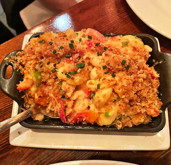 Not your childhood mac and cheese. This lobster-studded, golden-crusted masterpiece makes a compelling case for mac and cheese as a legitimate adult food group.