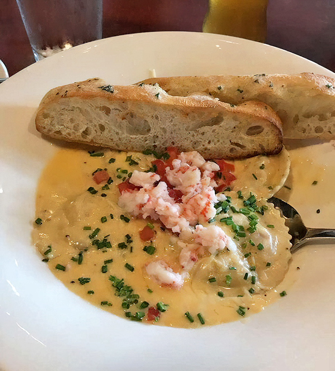 This lobster ravioli isn't just a dish, it's a warm hug in food form. The bread is just there to ensure not a drop of that sauce escapes.
