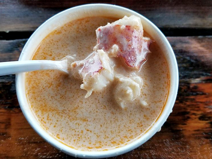 This lobster bisque spoonful reveals the universe's greatest secret: happiness is actually a warm, creamy soup with seafood chunks.