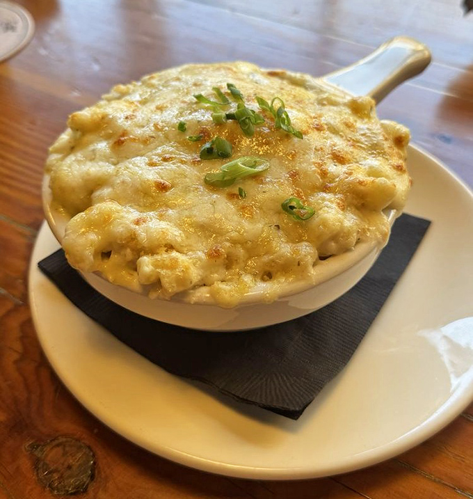 The mac and cheese arrives bubbling hot, its golden crust hiding a creamy treasure beneath&mdash;comfort food that's had a serious upgrade.