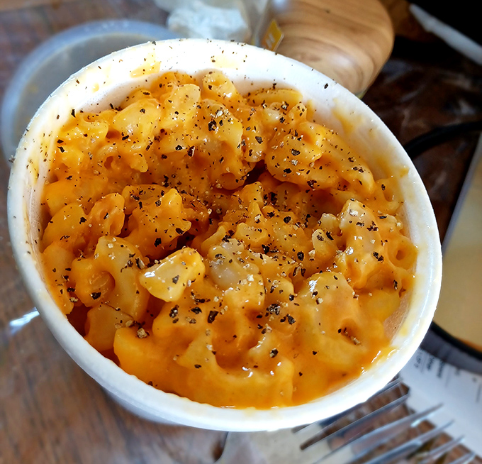 Mac and cheese that doesn't apologize for being exactly what it should be: creamy, comforting, and sprinkled with enough black pepper to remind you it means business.