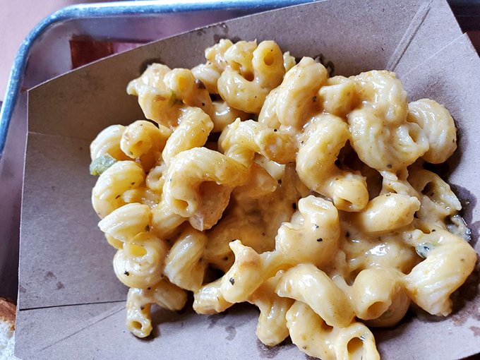 Mac and cheese that doesn't know it's a side dish. This creamy, smoky masterpiece demands equal billing with the meats, and rightfully so.