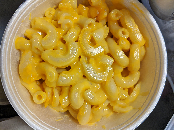 Mac and cheese that glows like edible sunshine. This isn't just comfort food; it's a warm hug for your taste buds.
