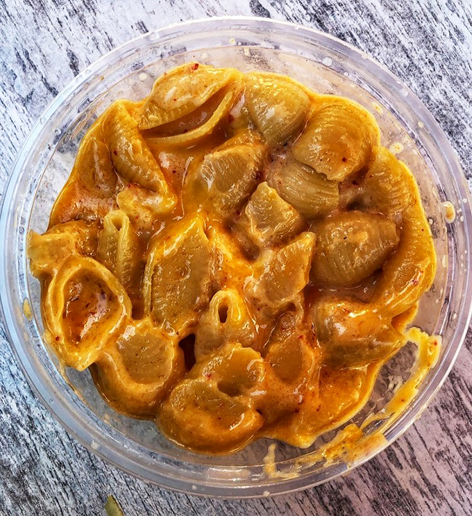 Korean sweet potatoes bathed in a vibrant sauce that makes regular mac and cheese look like it's not even trying. Comfort food that refuses to be boring.