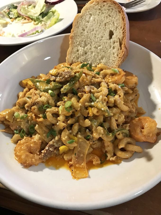 Mac and cheese that would make your grandmother simultaneously proud and jealous. Those green onions aren't just garnish – they're the perfect counterpoint to all that creamy decadence.