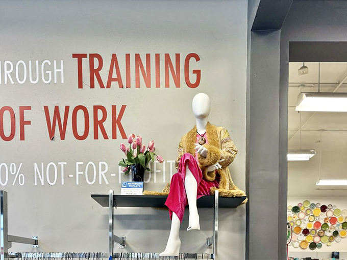 This mannequin isn't just modeling clothes&mdash;she's showcasing Goodwill's mission of dignity through work, draped in golden opportunity.