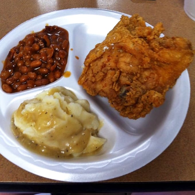 Baked beans and mashed potatoes flanking that legendary chicken&mdash;a Southern trinity that proves heaven exists and it's on this very plate.