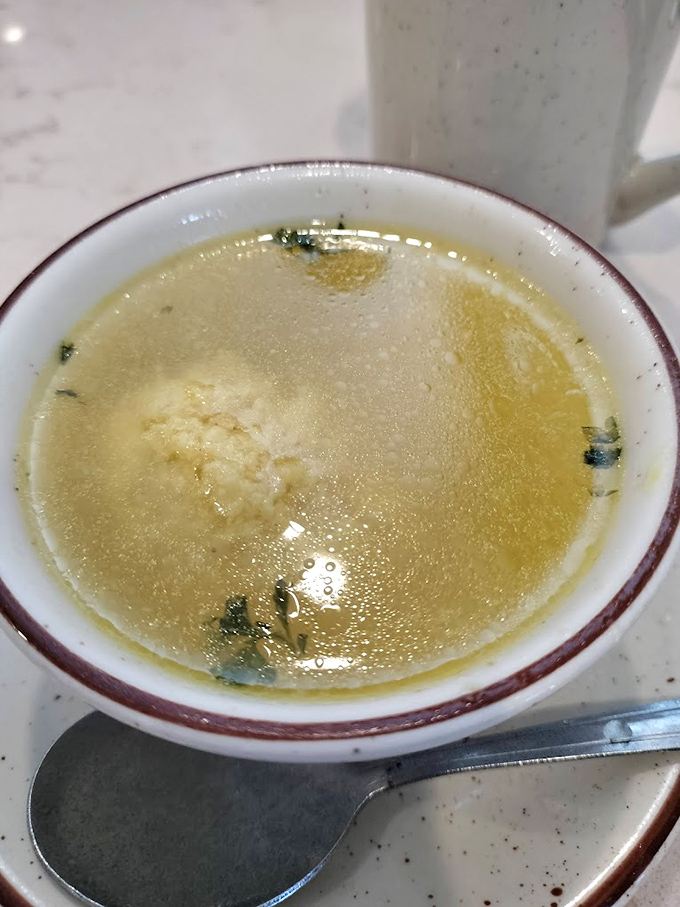 Clear broth, tender matzo ball, subtle herbs&mdash;this soup doesn't just warm the body, it soothes the soul. Jewish penicillin at its Pennsylvania finest.