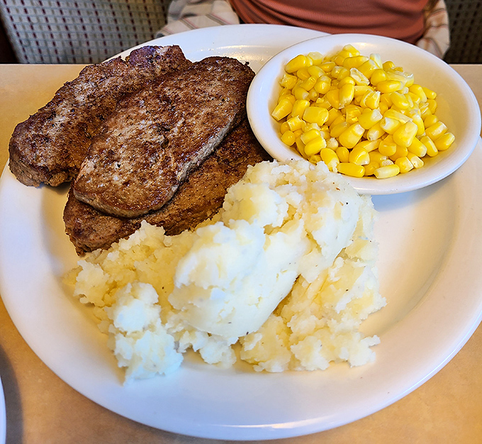 Sirloin tips cooked to that perfect sweet spot between tender and charred, with sides that know their supporting role. Comfort food royalty.