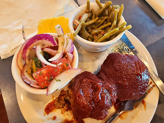 Meatloaf that would make your grandmother jealous, slathered in tangy sauce and paired with garden-fresh sides. Comfort defined.