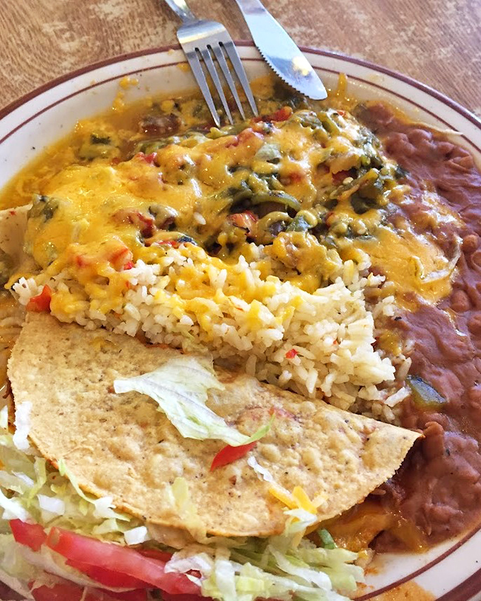 This isn't just a plate of food &ndash; it's a geography lesson in New Mexican flavors where rice, beans, cheese, and chile create perfect harmony.