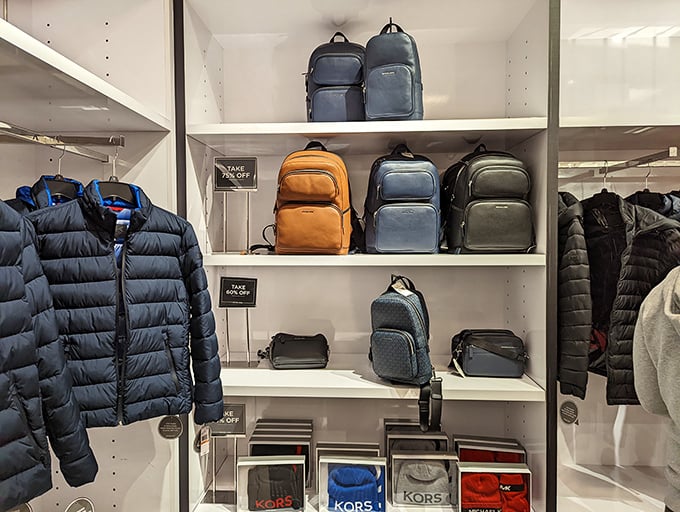 Puffer jackets and designer backpacks living their best life on display. Michael Kors without the Michael Kors prices—a beautiful relationship.